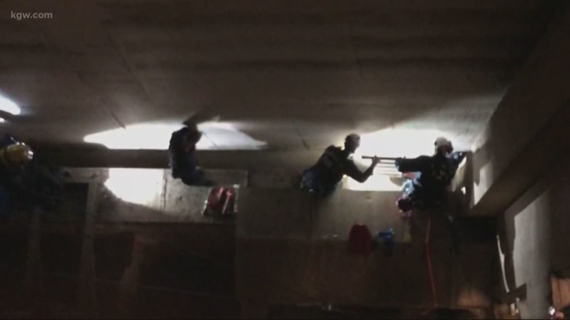 Man gets stuck between two buildings | kgw.com