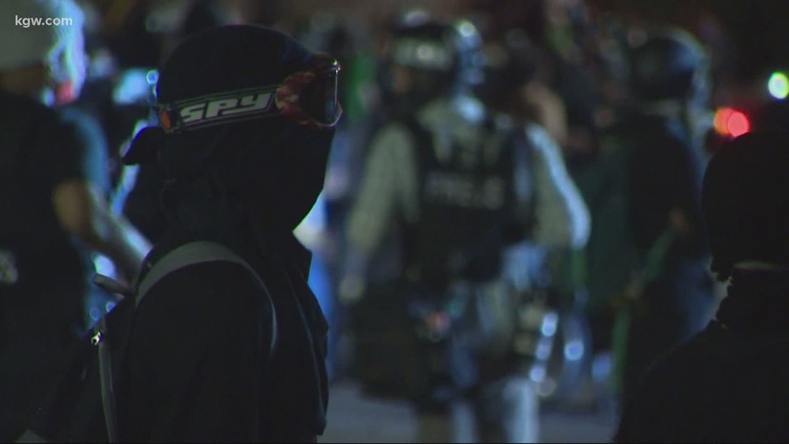 Protesters demonstrate outside Kelly Building in Portland | kgw.com