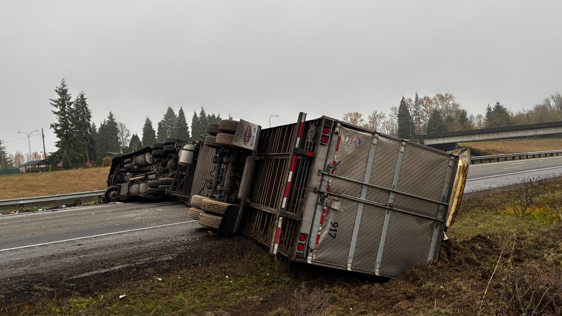 Semi-truck rollover blocks I-5 in Castle Rock; driver cited for ...
