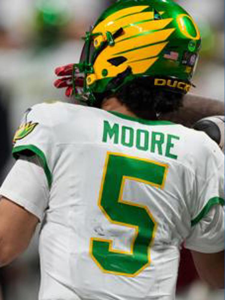 Dante Moore and the Oregon Ducks self-destruct in 56-22 Peach Bowl loss ...