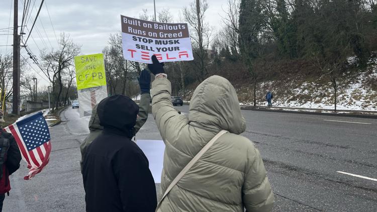 Portlanders rally against Elon Musk, DOGE outside of Tesla dealership ...