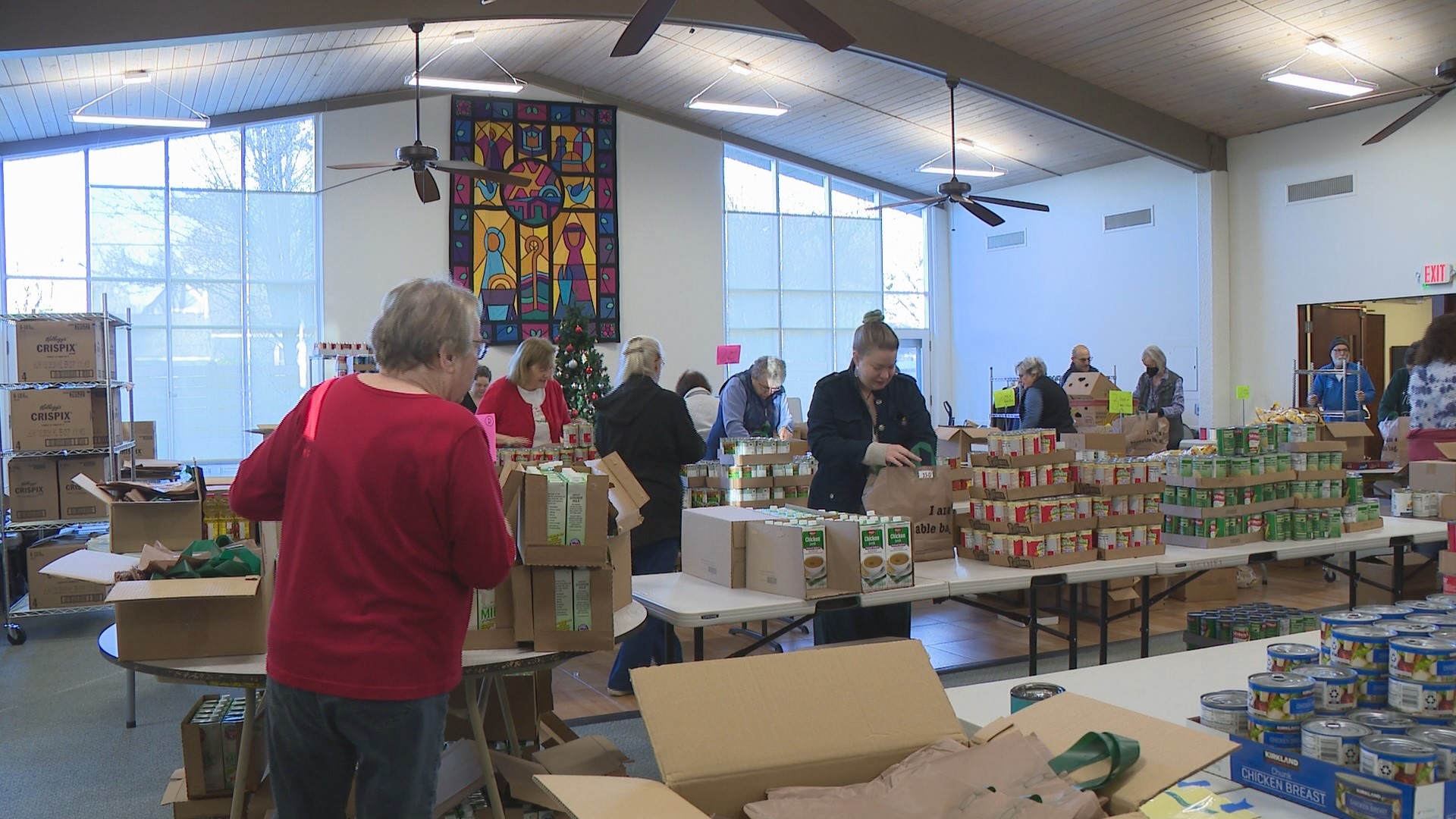 Volunteers pack food bags for Beaverton High School students | kgw.com