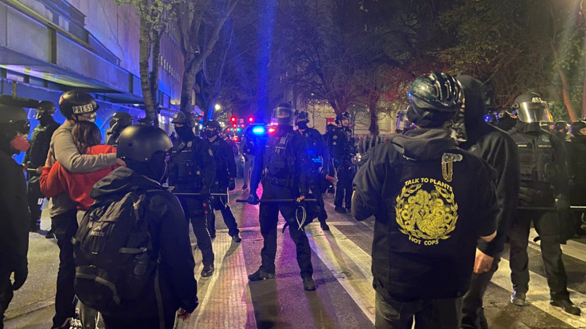 Police declare riot after crowd smashes windows in downtown Portland ...