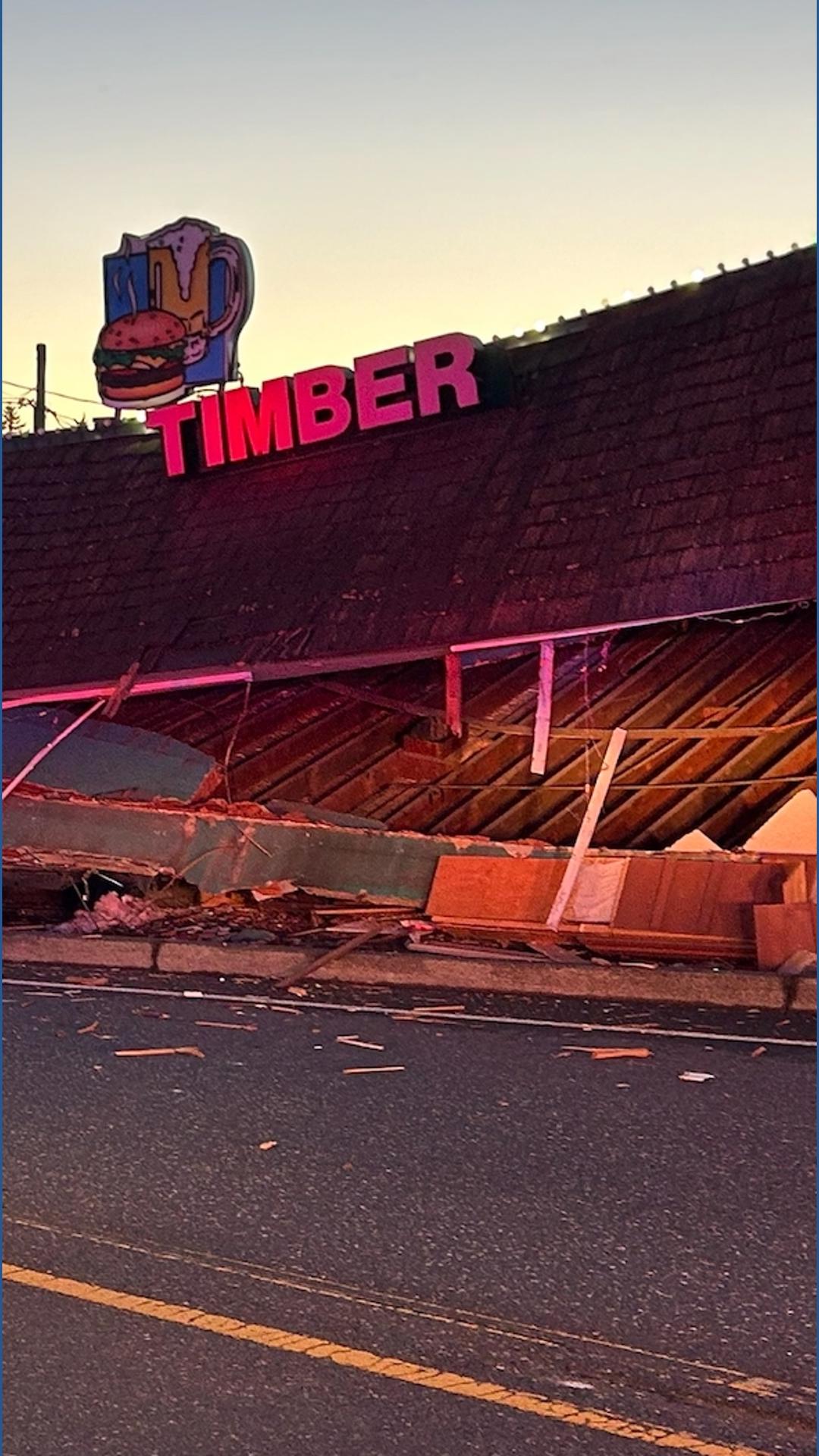 Person dies after car crashes into sports bar causing partial roof ...