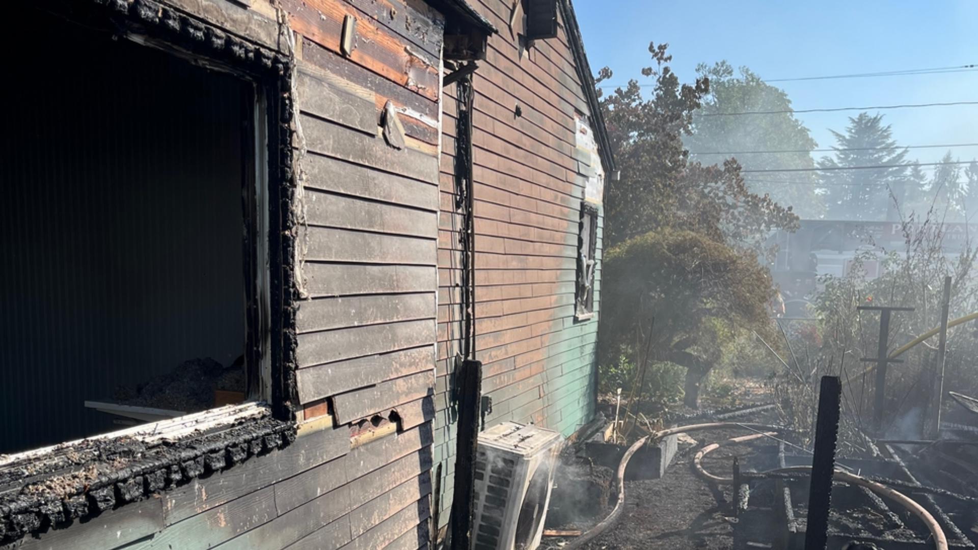 Crews extinguish house fire that spread to second home in Southeast ...