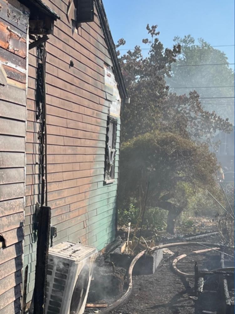 Crews extinguish house fire that spread to second home in Southeast ...