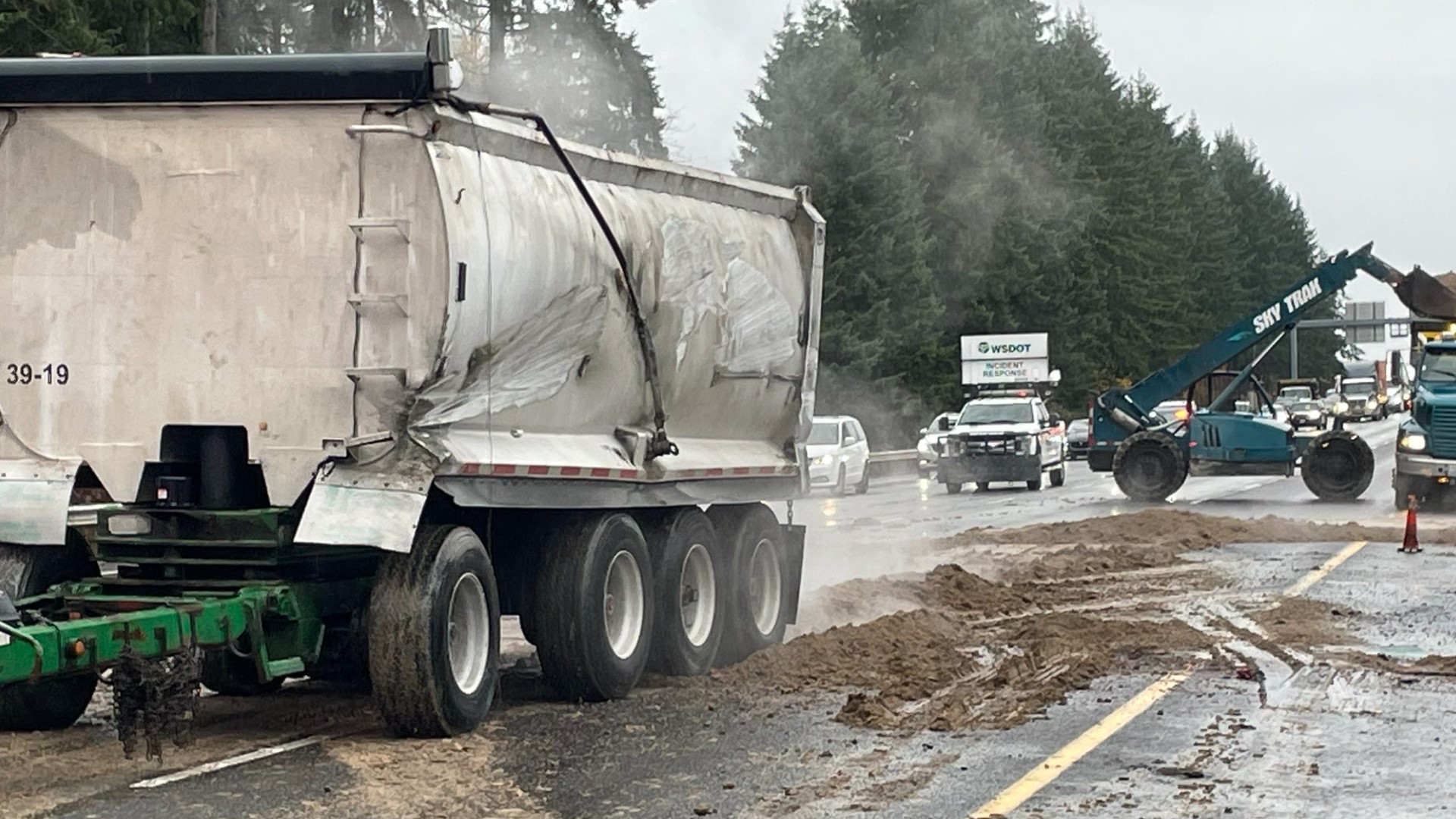 Photos: Dump truck overturns, spills 'treated human waste' onto I-5 | kgw.com