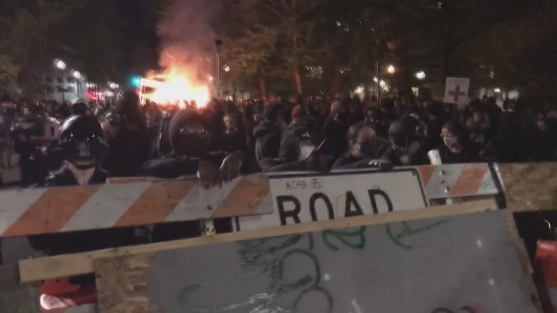 Raw: Protesters burn downtown Portland elk statue | kgw.com