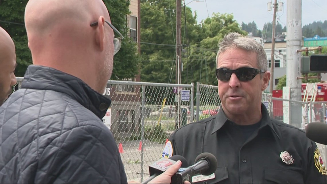 Portland fire officials investigate the inside of the May Apartments ...