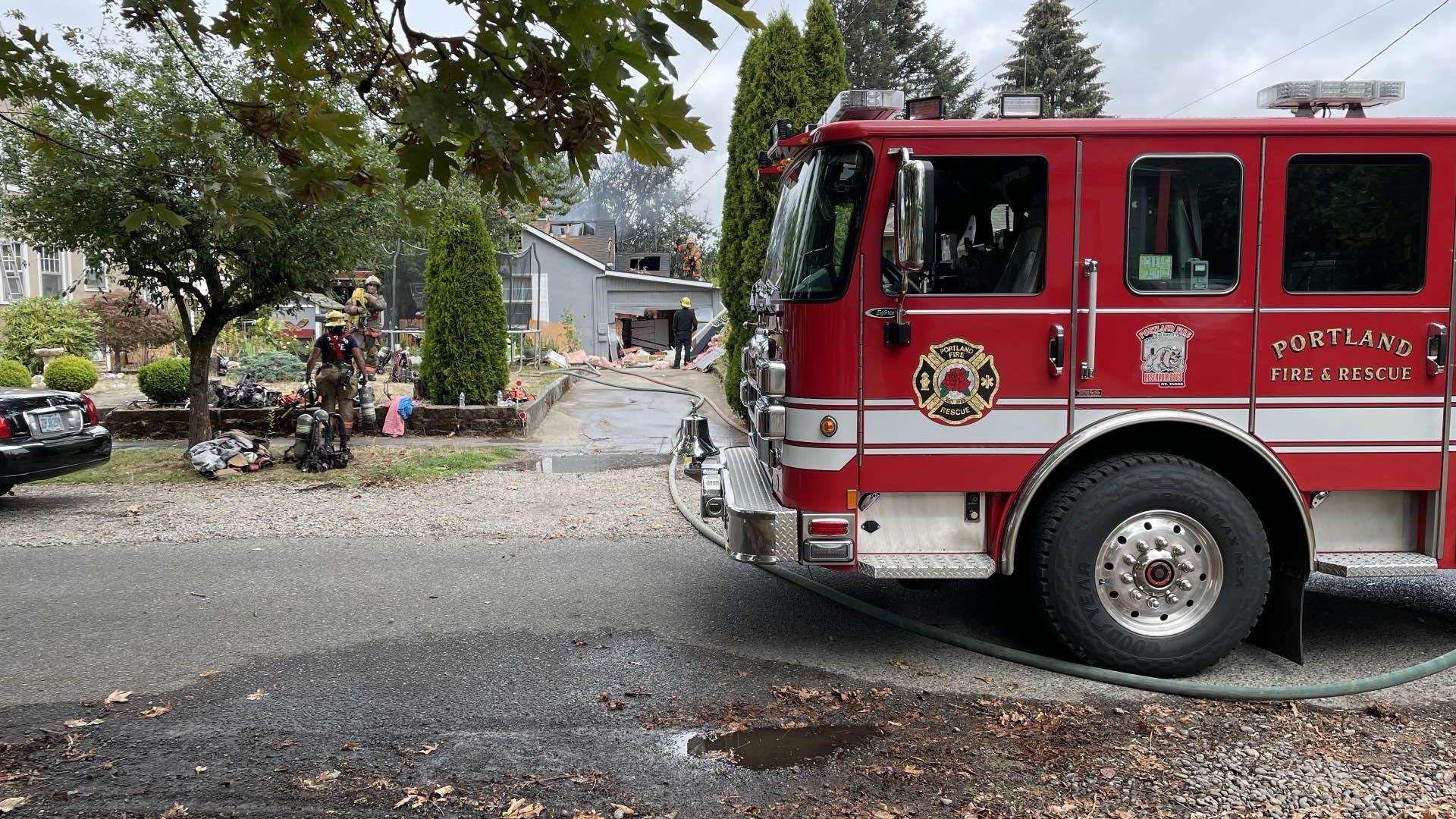 Portland firefighters rescue woman, dog from burning home | kgw.com