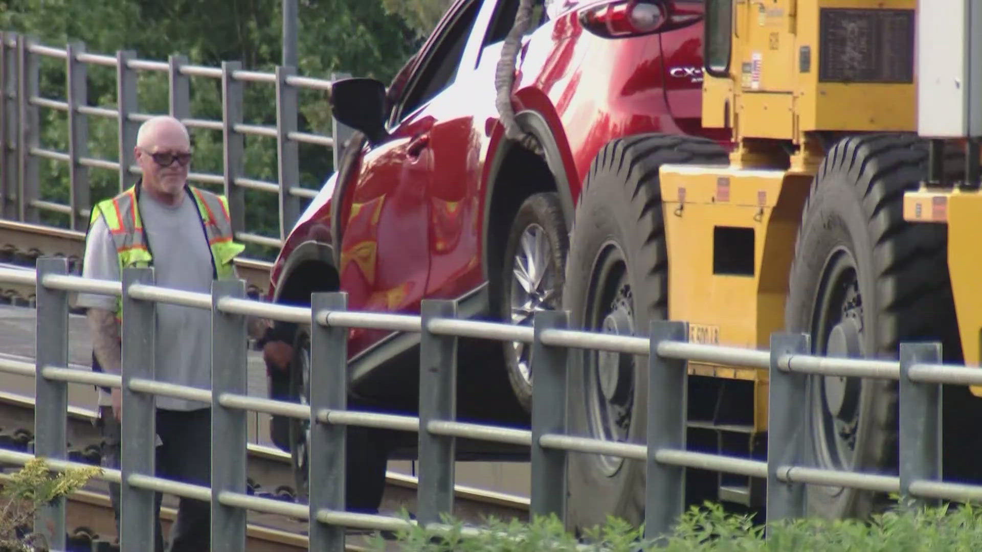 Car drives onto elevated light rail tracks in Seattle | kgw.com